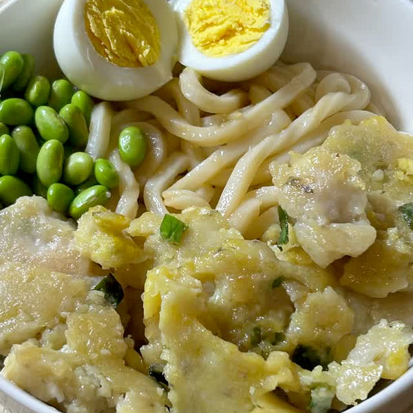 Udon with fish paste, boiled egg, and edamame